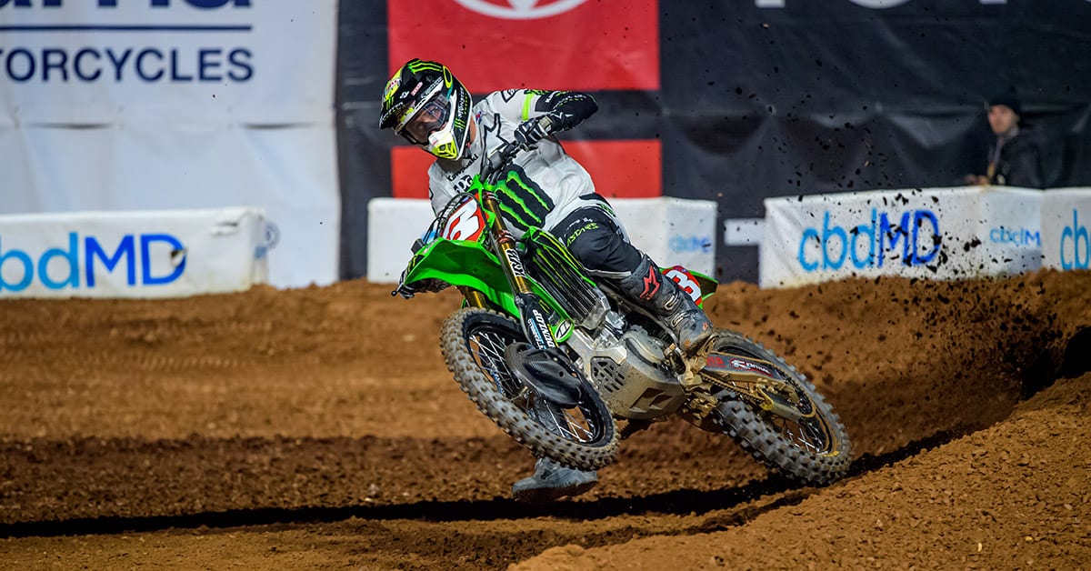 Eli Tomac holds his hands up on the collision with Blake Baggett ...
